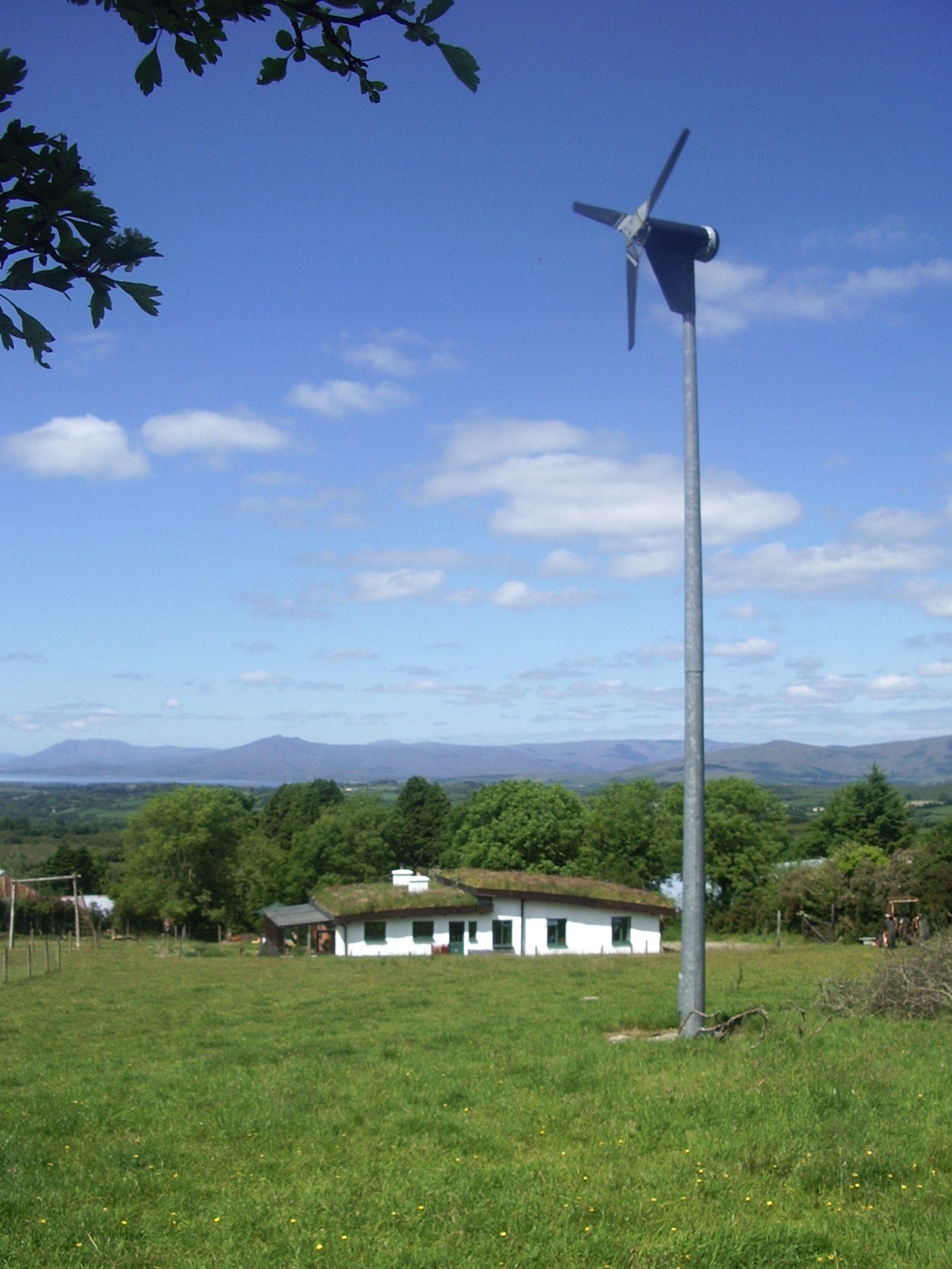 wind-genny-and-house-background | Wind Turbine Electronics – Inverters ...
